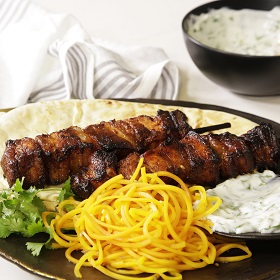 Pork espetadas with pickled butternut and flat bread | Woolworths.co.za