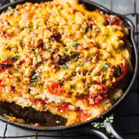 Baked mielie rice tart with tomato sauce, cheese, chilli and herbs ...