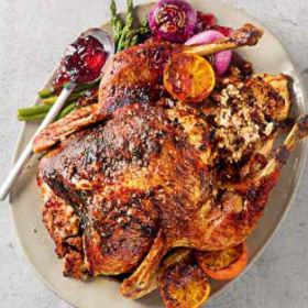 Roast turkey with a spiced crimson raisin and walnut stuffing ...