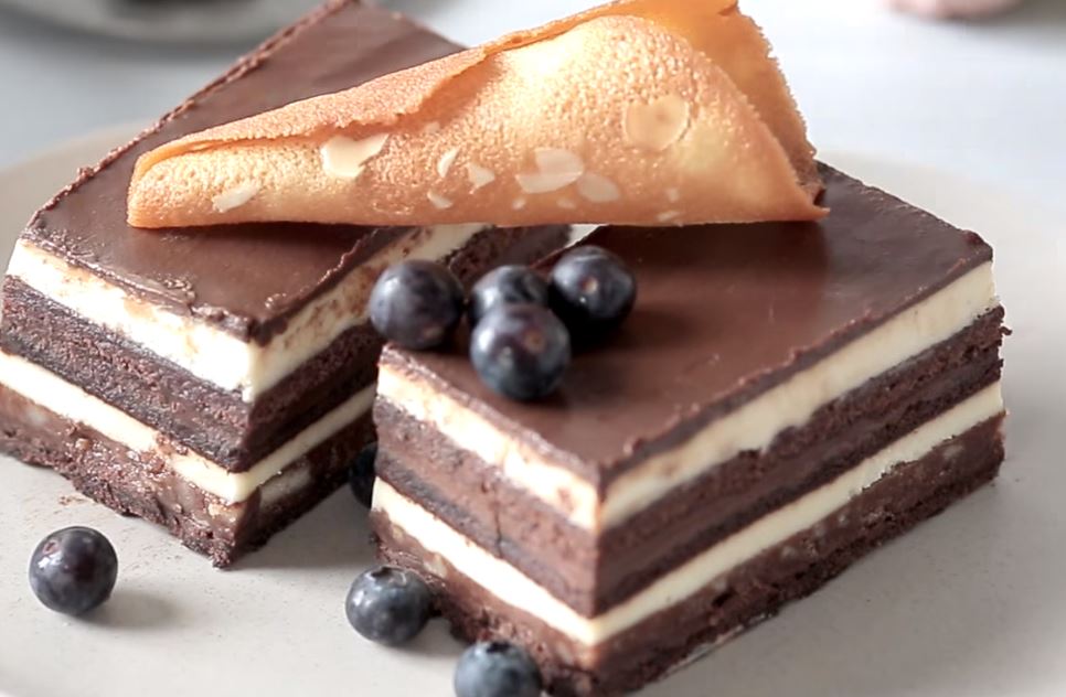 Triple chocolate mousse cake topped with handmade flaked almond tuille ...